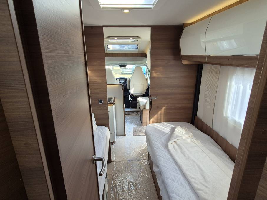 Rapido 665F, 2019, end washroom, fixed single beds