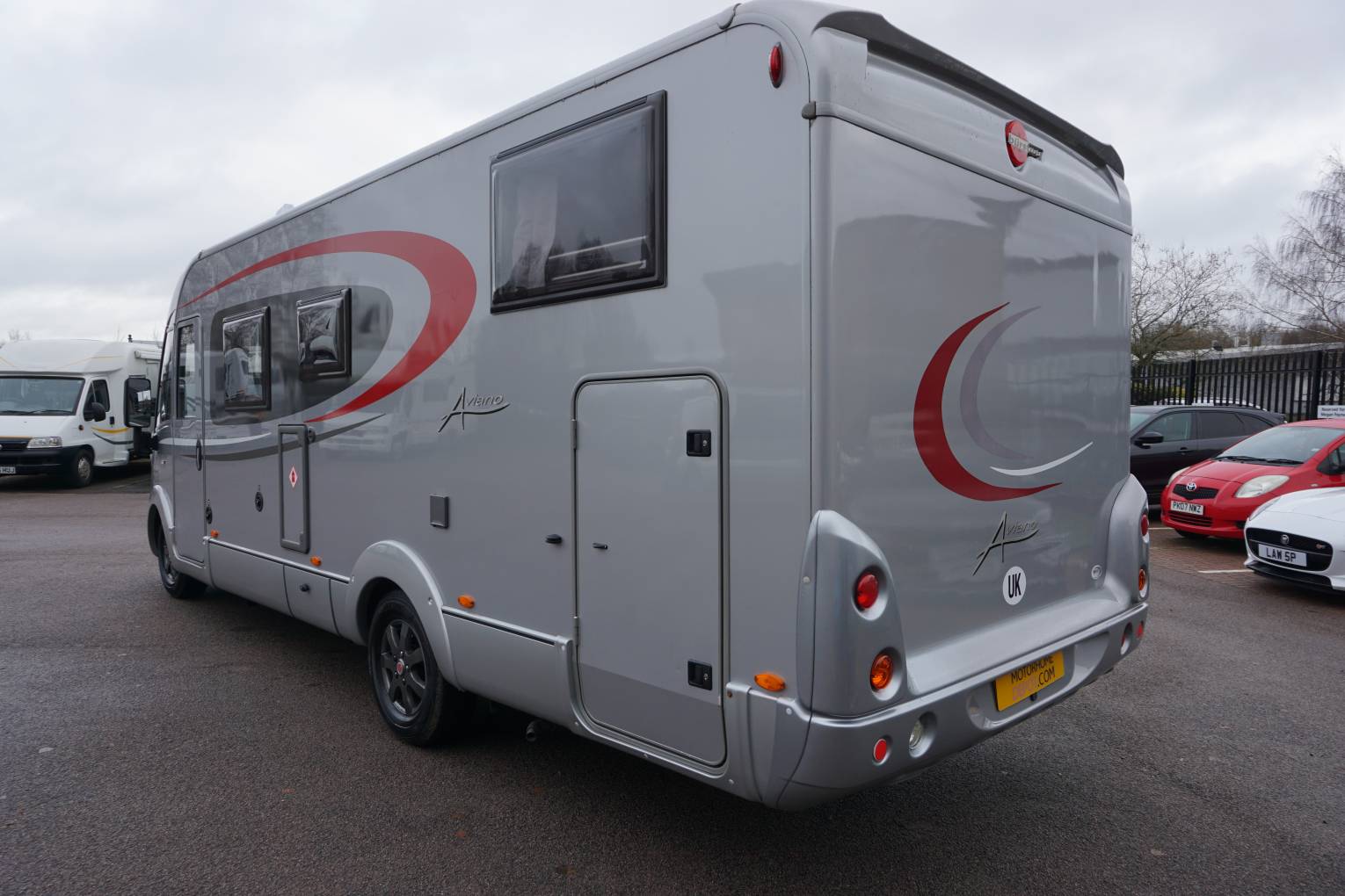 Burstner Aviano i728 4 berth 4 belts twin rear beds above garage drop down front double bed